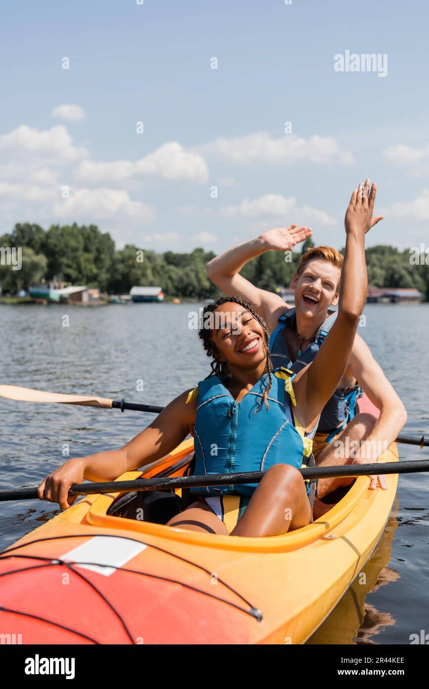 charming and carefree african american woman and young redhead man in ...
