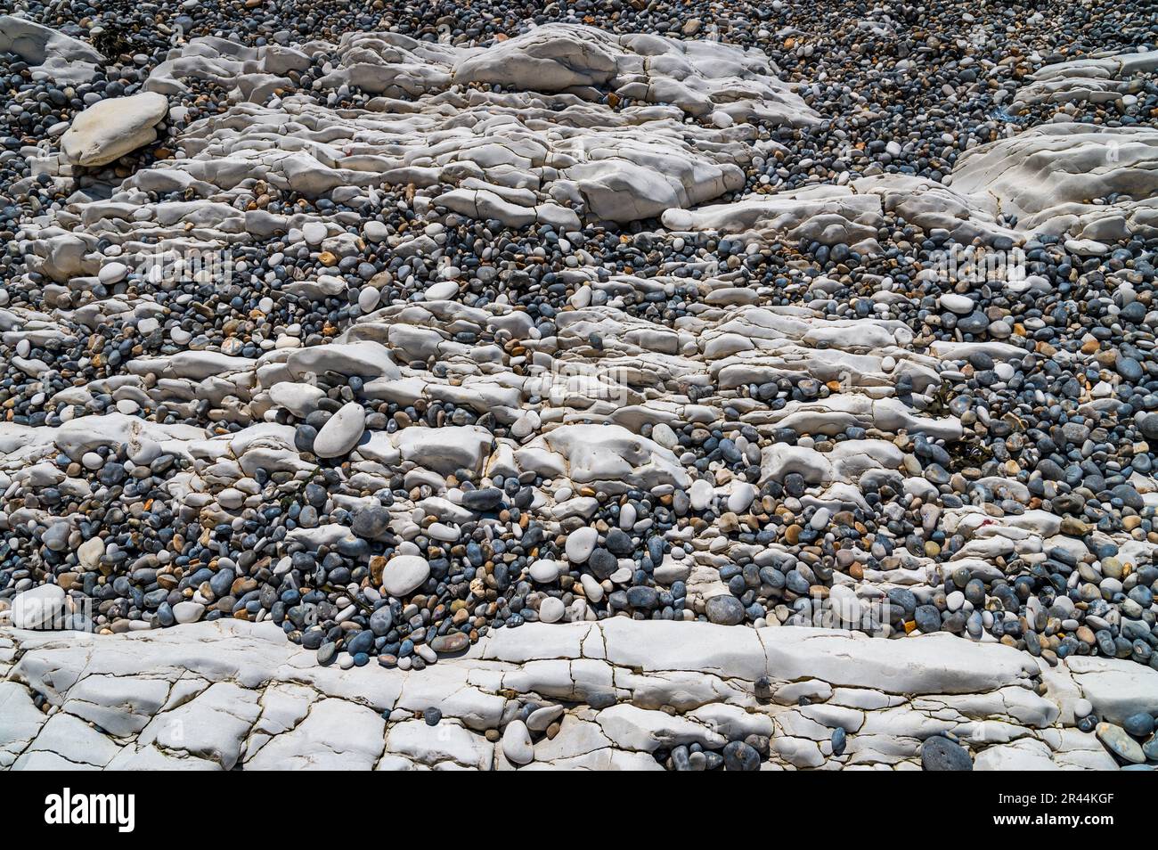 Pebbles and chalk rocks on a beach in Dorset for wall art Stock Photo ...