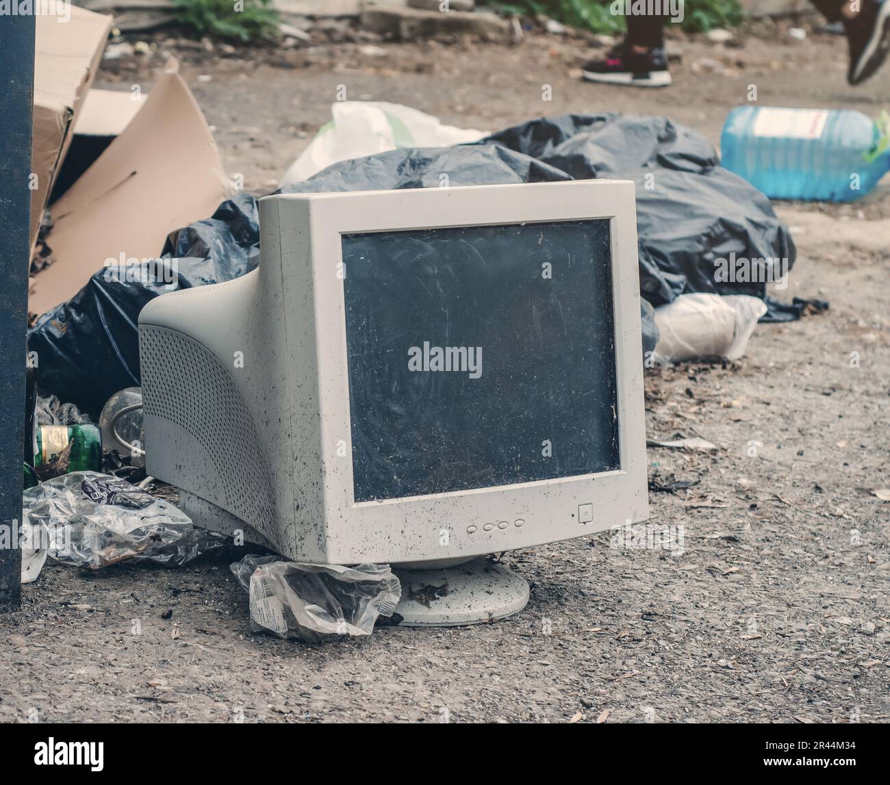 Old CRT monitor in landfill. Recycling of computer components ...