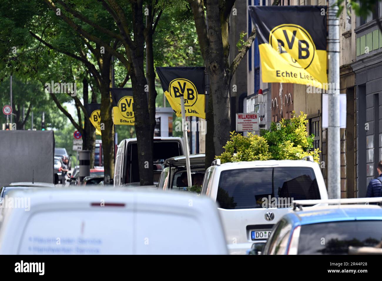 Dortmund, Germany. 26th May, 2023. Cars drive past BVB flags. On ...