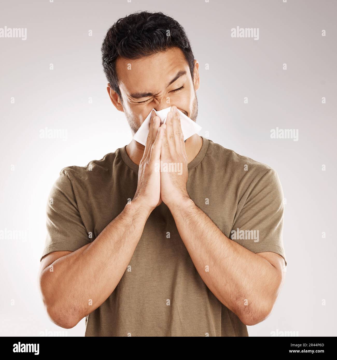 Man sneezing, blowing nose and tissue with virus and health issue ...