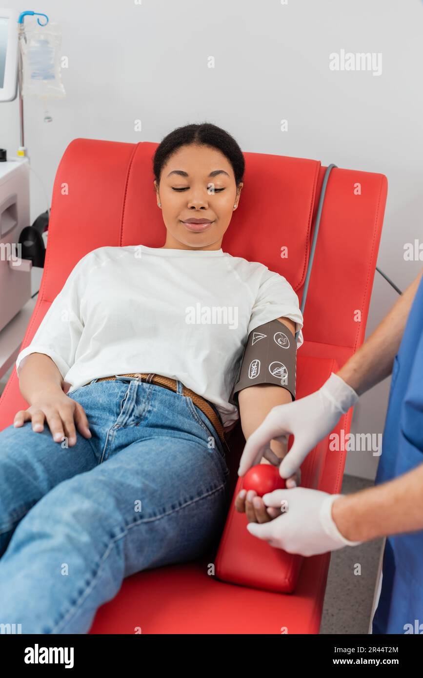 Young people giving blood hi-res stock photography and images - Alamy
