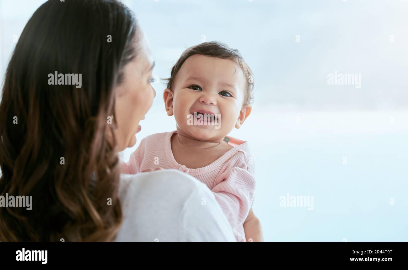Baby laughing, portrait and mom in a home with newborn, care and parent ...
