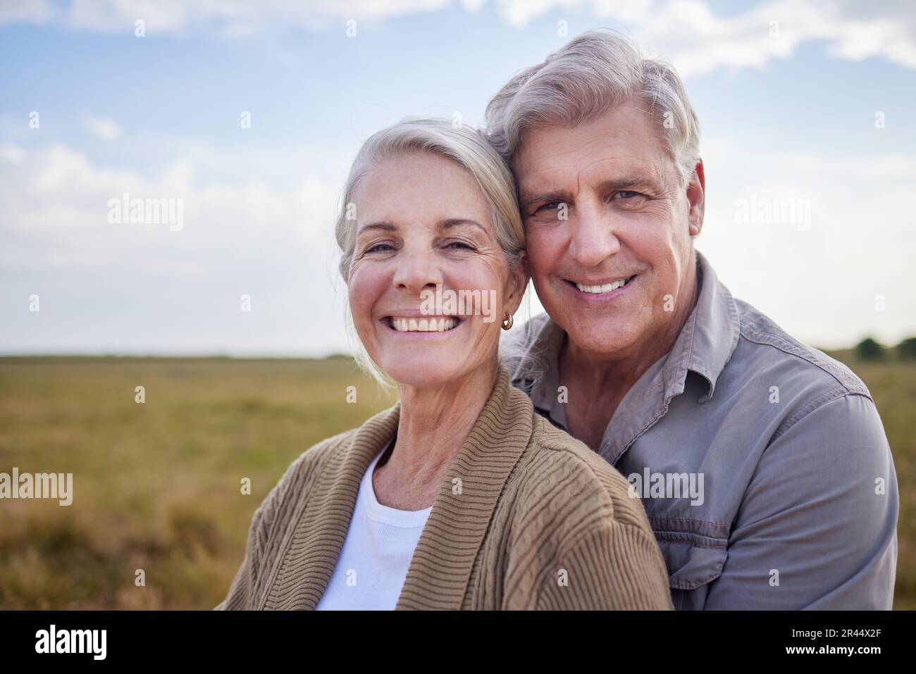 Love, hug and happy with portrait of old couple in nature for bonding, smile and romance. Calm ...