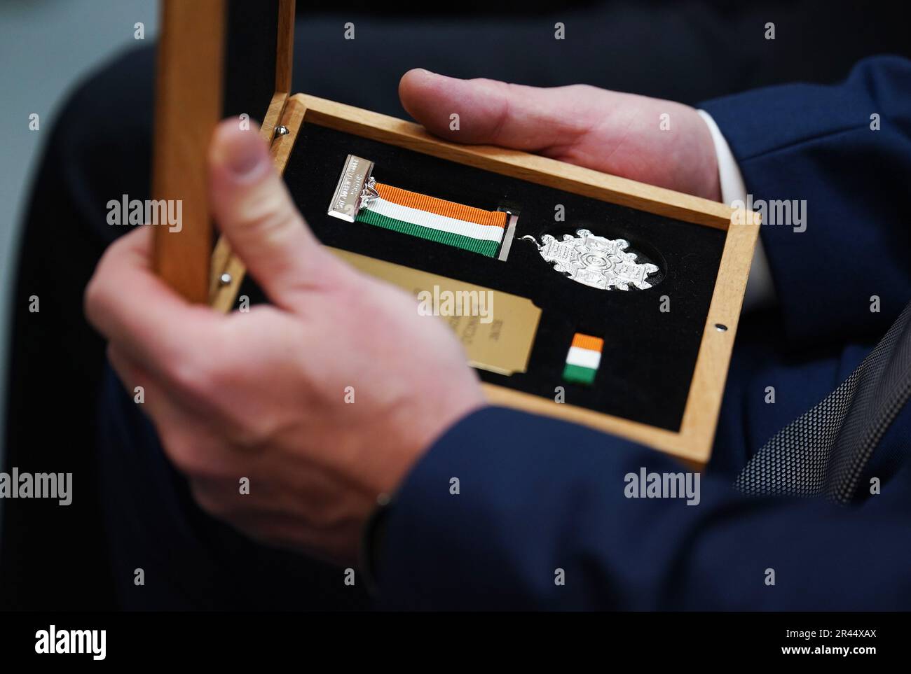 A Scott Medal is held during a ceremony to award deceased, retired and ...