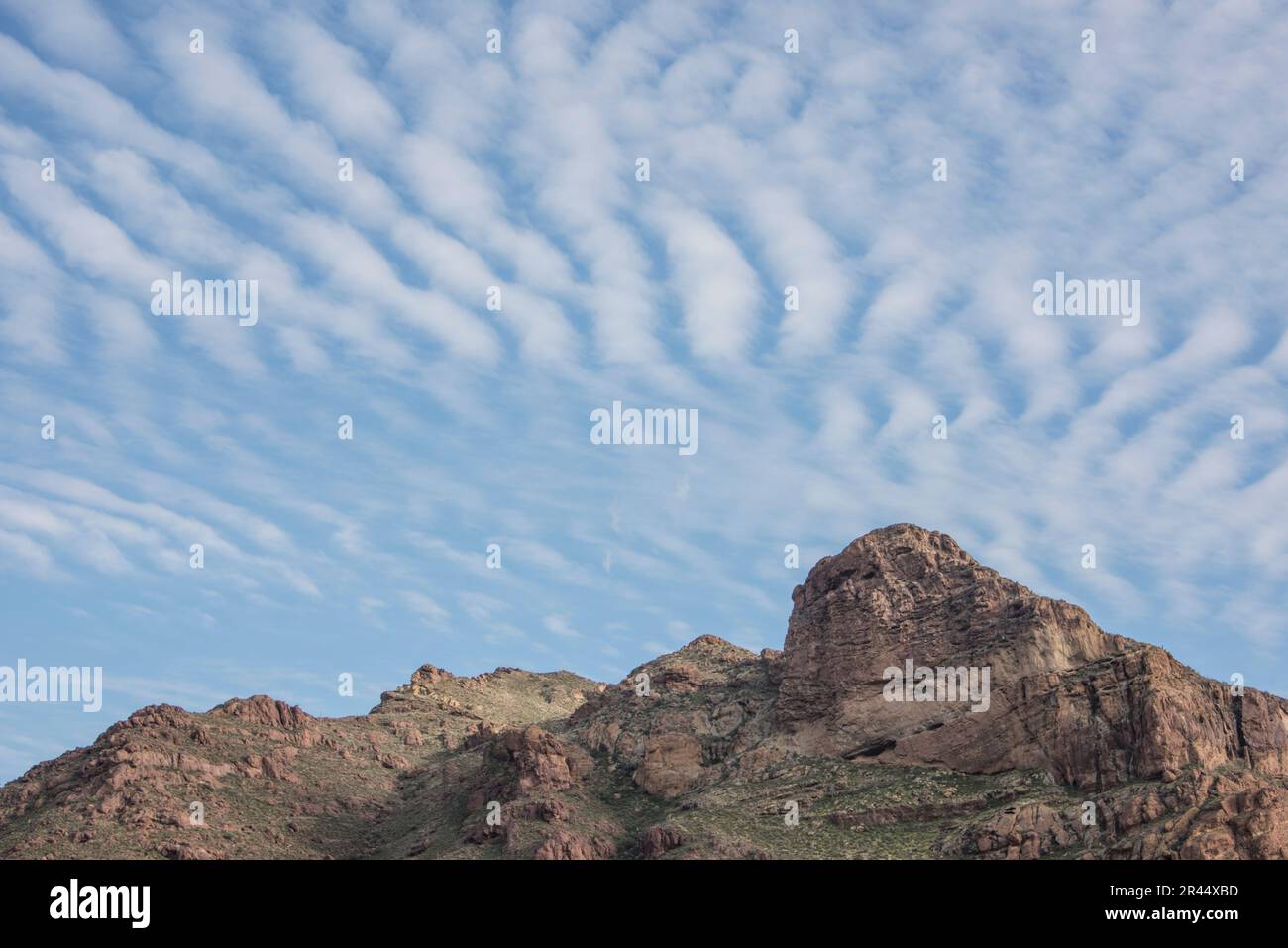 Mackerel Sky or sliced clouds above rocky mountains in Alamo canyon ...