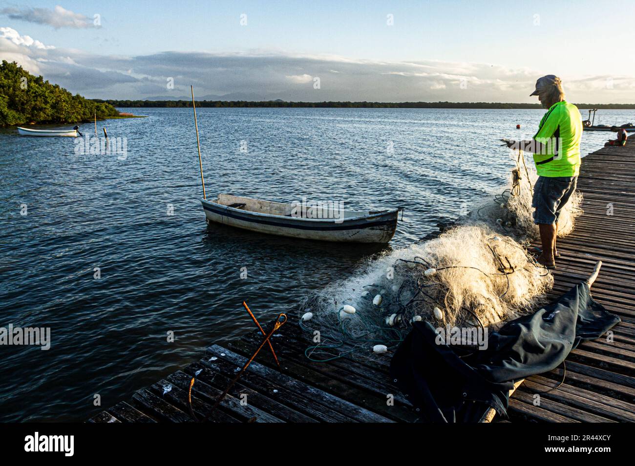 Fisherman with a fishing net at Pirajubae Marine Extractive Reserve ...