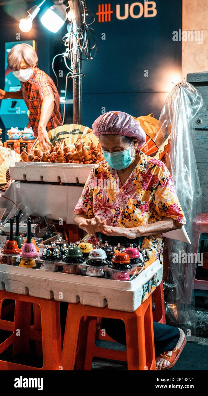 Female vendor behind counter hi-res stock photography and images - Alamy
