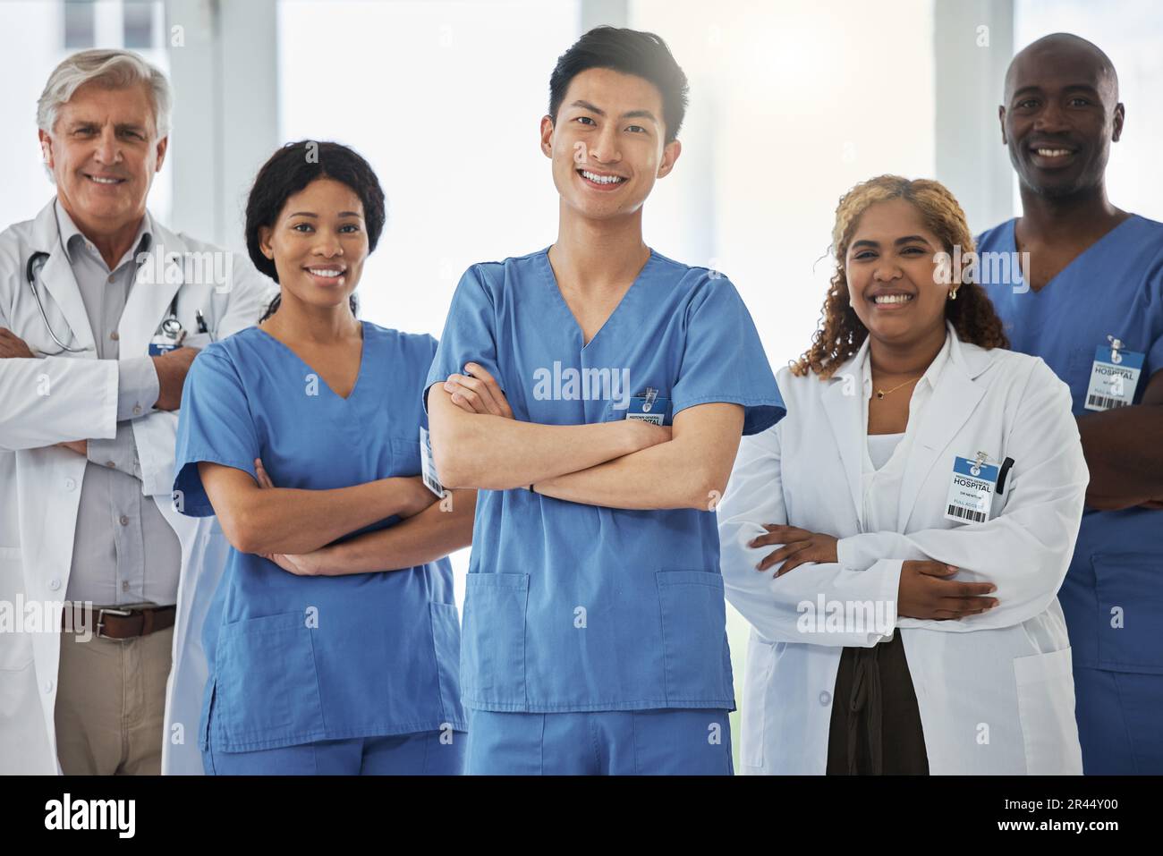 Portrait, nurses and group of doctors with arms crossed standing ...
