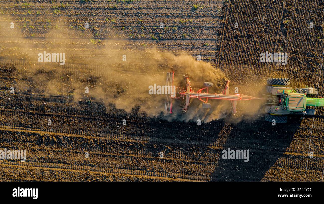 Above top view, tractor pull disc harrow, harrowing farmland, preparing ...