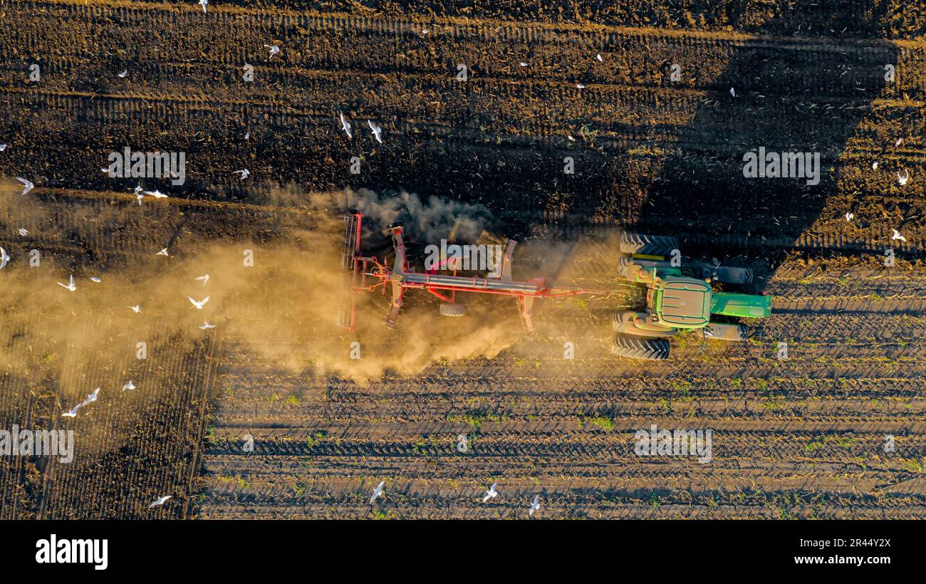 Above top view, tractor pull disc harrow, harrowing farmland, preparing ...