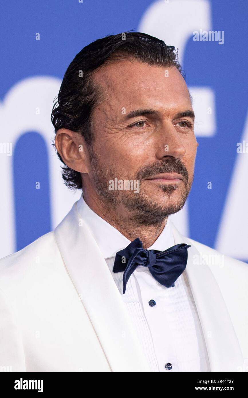 William Abadie poses for photographers upon arrival at the amfAR Cinema ...