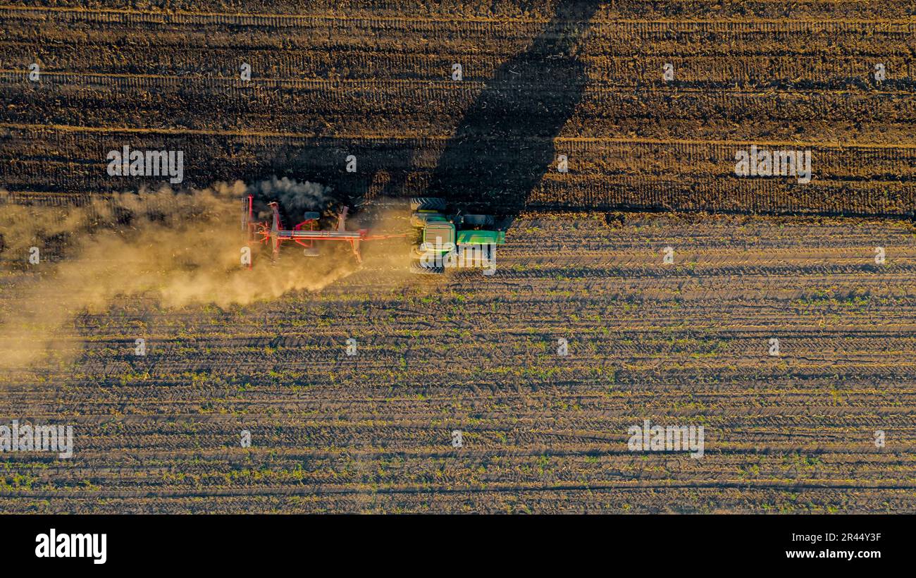 Above top view, tractor pull disc harrow, harrowing farmland, preparing ...