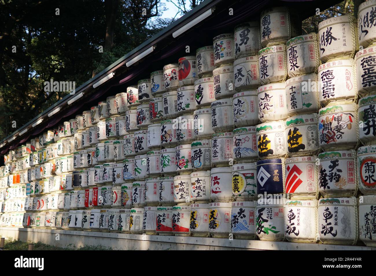 The rows of organized sake barrels at Meiji Jingu in Tokyo, Japan Stock ...