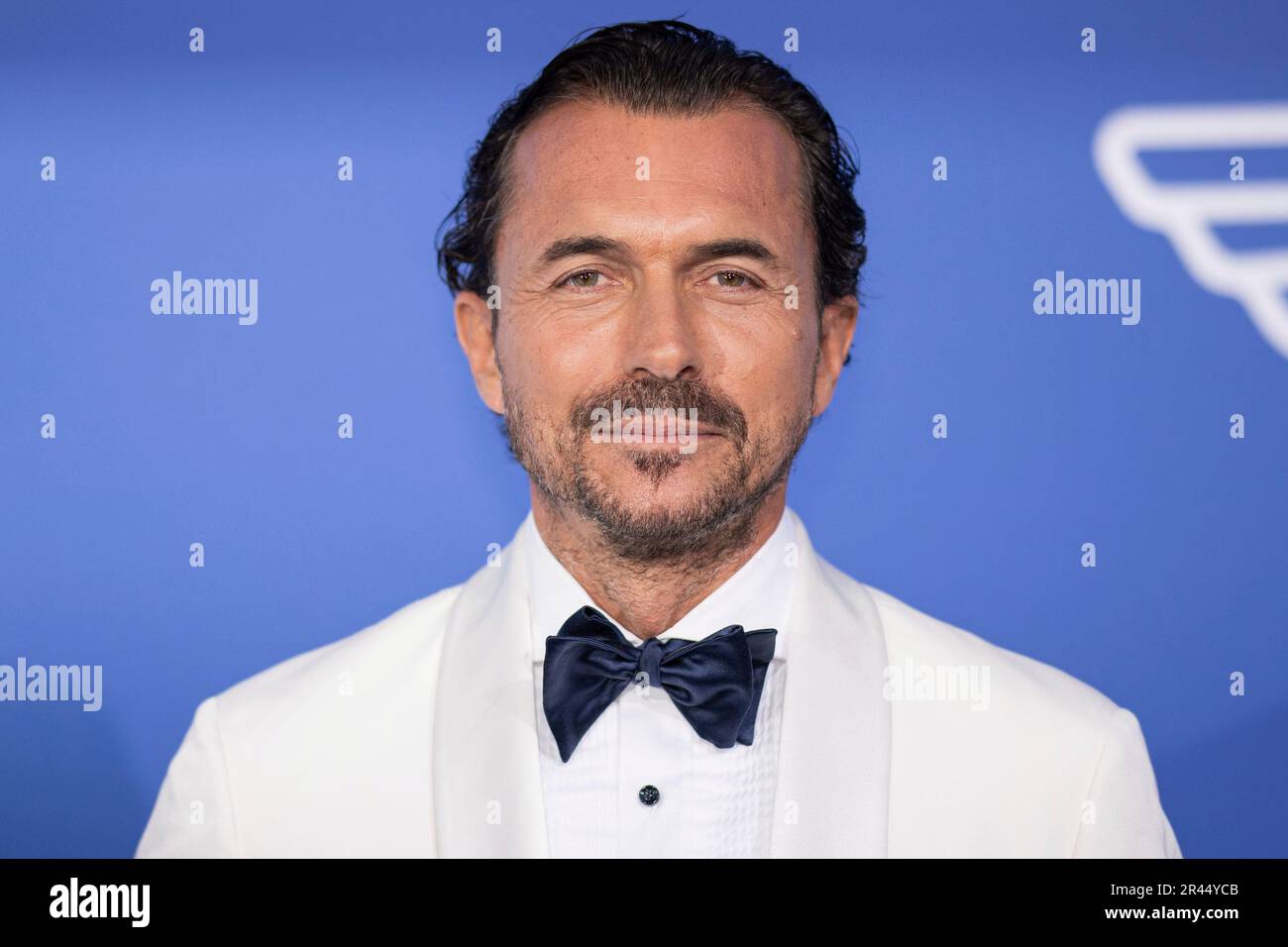 William Abadie poses for photographers upon arrival at the amfAR Cinema ...