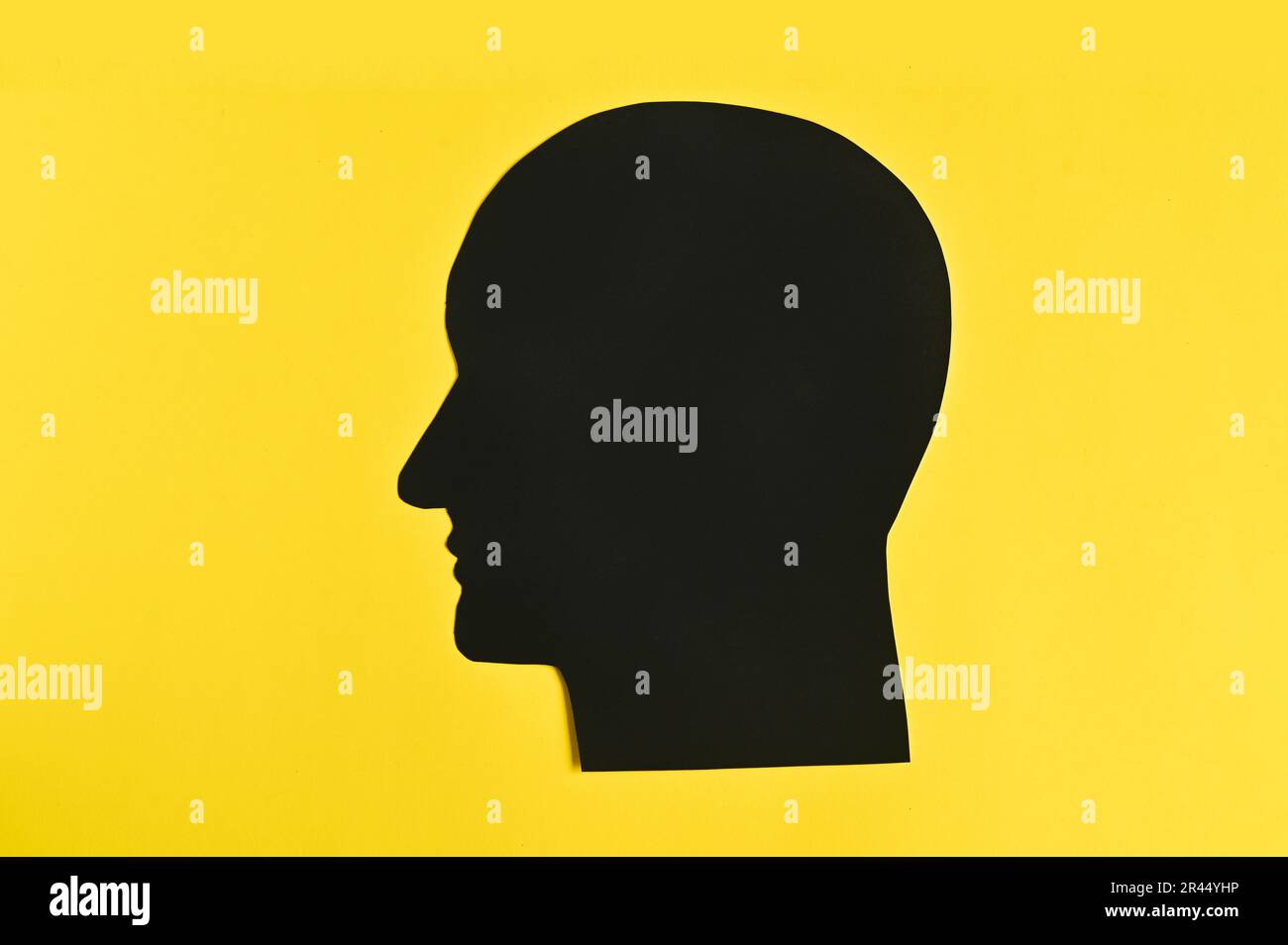 Male profile head on yellow background Stock Photo - Alamy