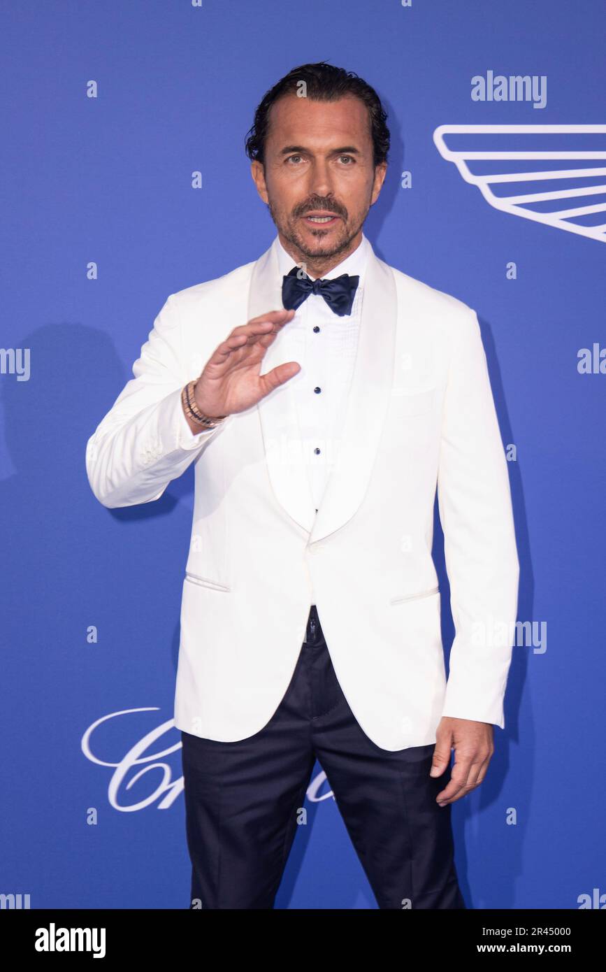 William Abadie poses for photographers upon arrival at the amfAR Cinema ...