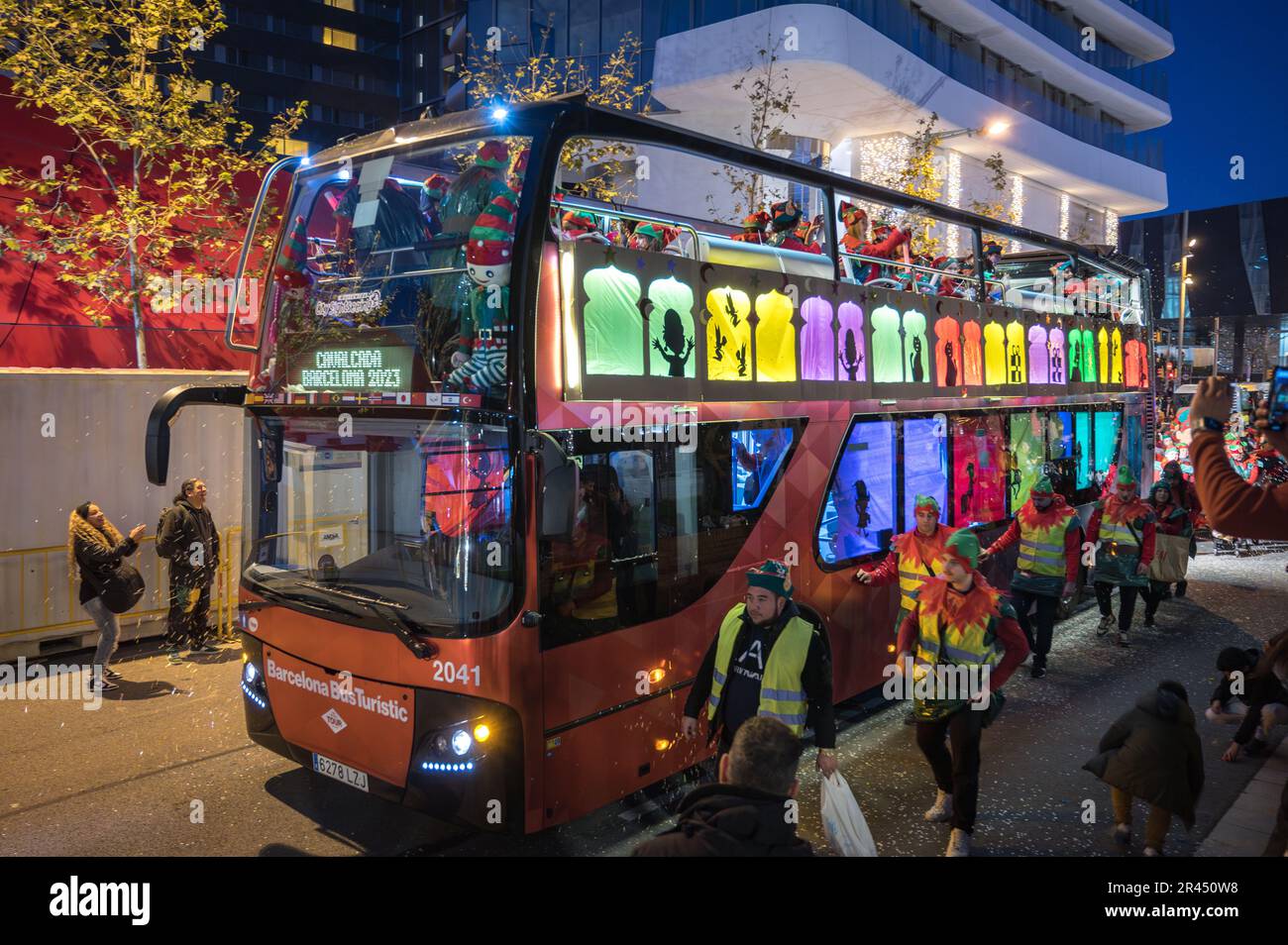 Truck of children throwing candy at the people at the parade of the ...