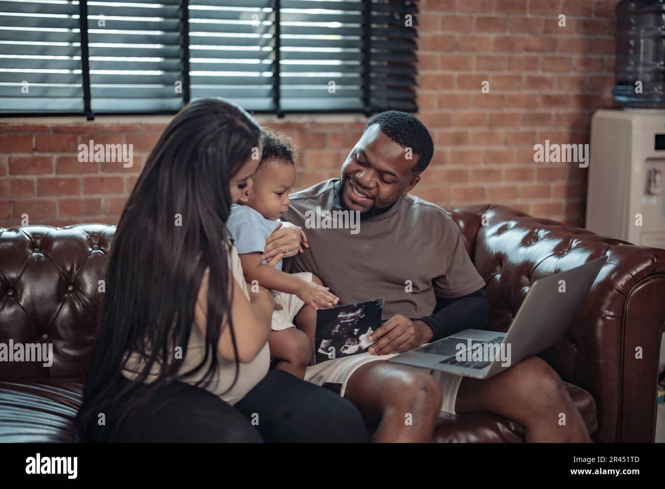 Family members see ultrasound images showing gender, health ...