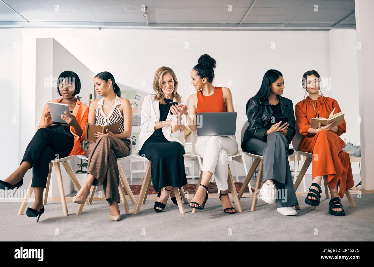 Waiting room, networking and business women with job search on phone ...