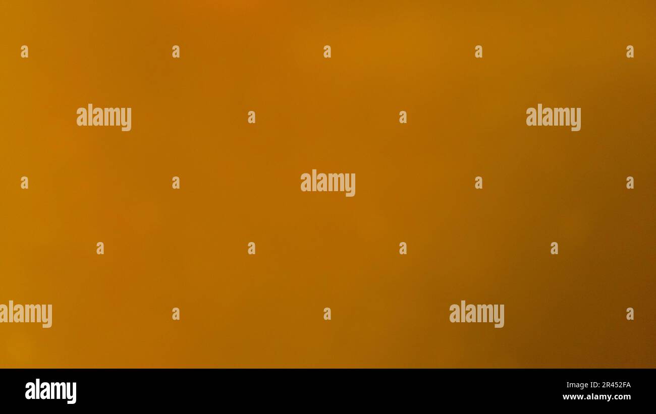 A bright orange background with a solid, uniform tone Stock Photo - Alamy