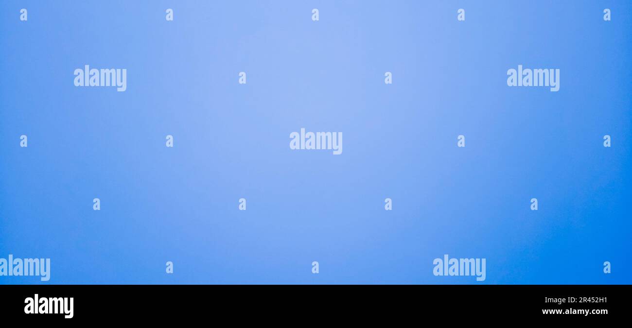 A bright blue background with a solid, uniform tone Stock Photo - Alamy