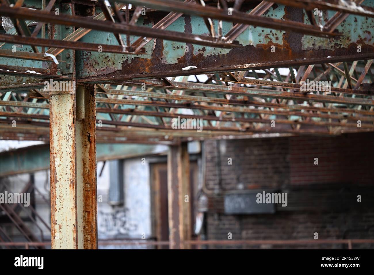 Close-up shot of a factory wall with rust and dirt covering the surface ...