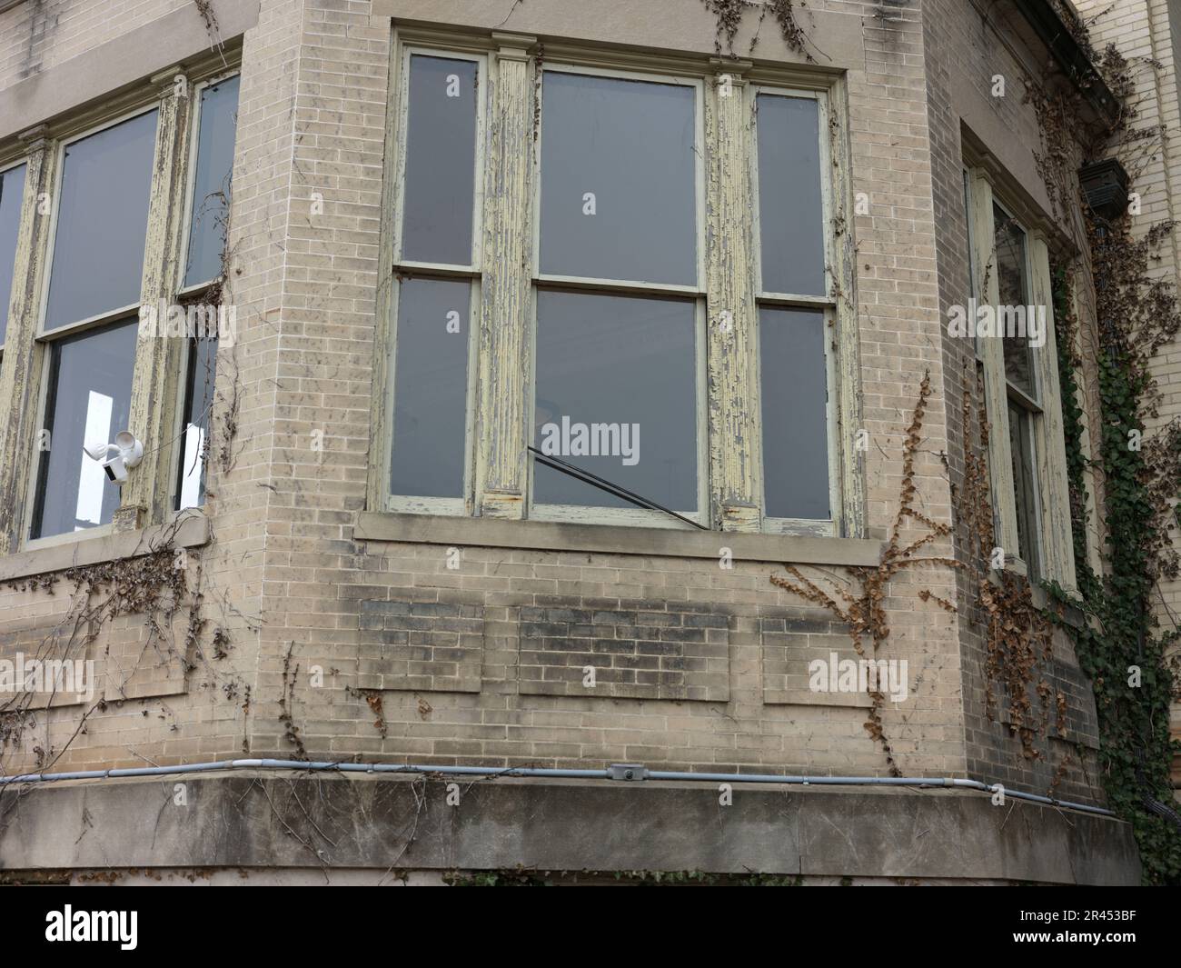 A striking image of a three-story building with big windows Stock Photo ...