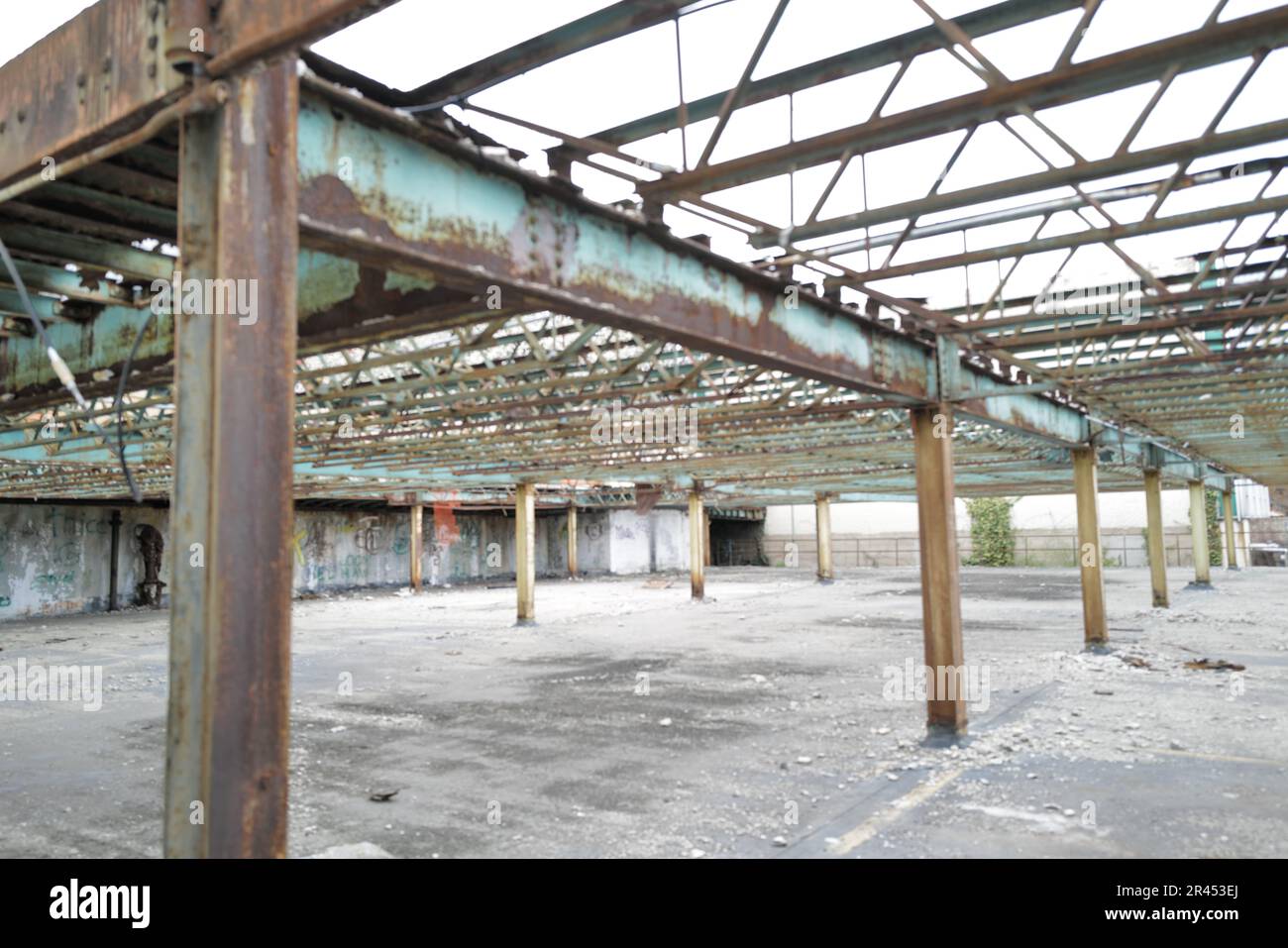 An industrial landscape featuring a vast expanse of open space with ...