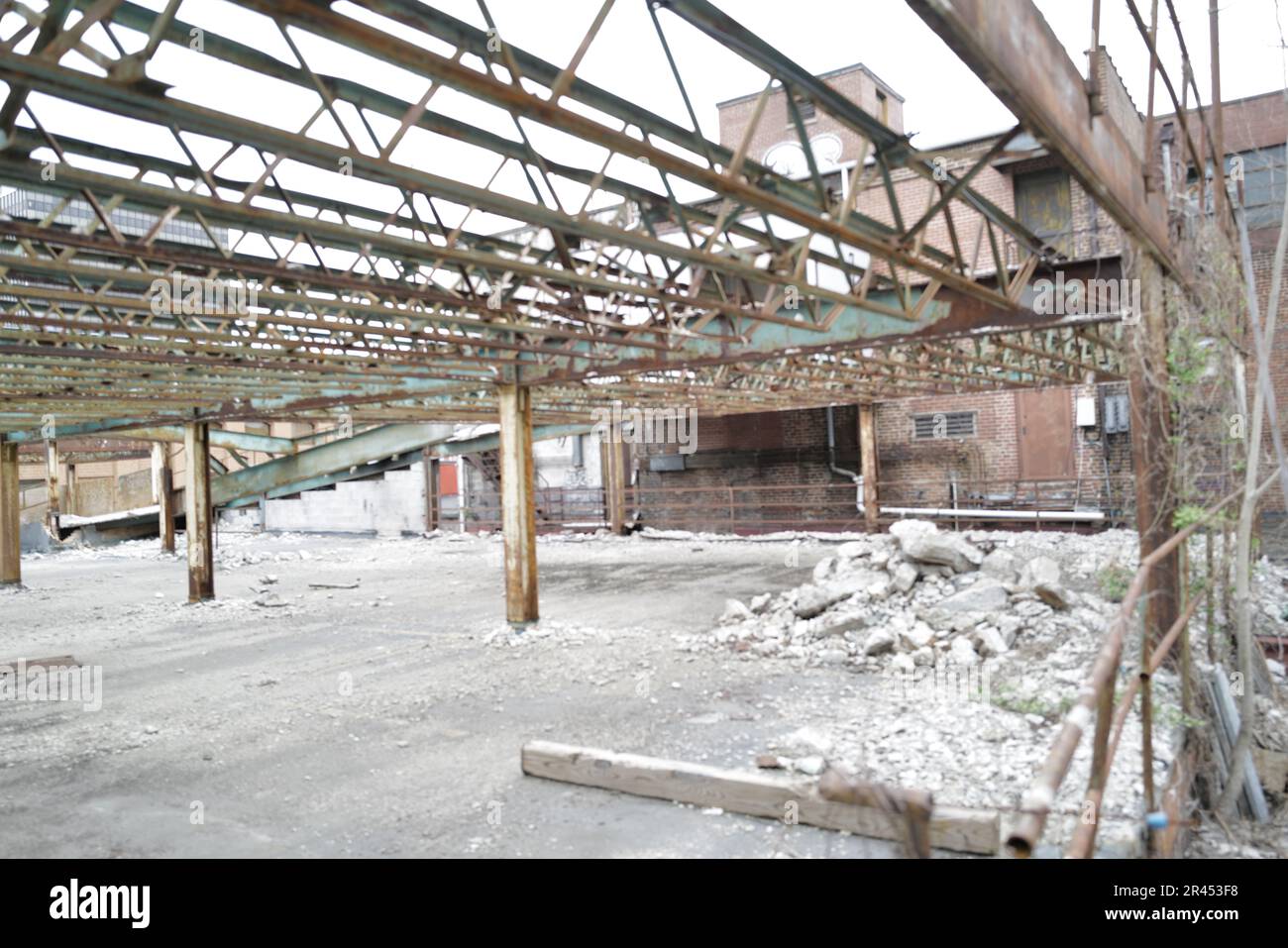 An abandoned industrial building with dilapidated metal structures and ...