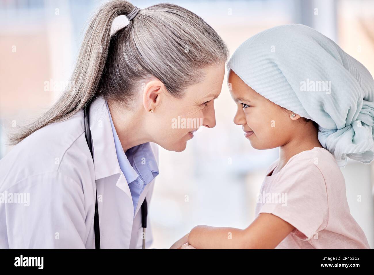 Smile, doctor and child on bed in hospital for children, health and ...