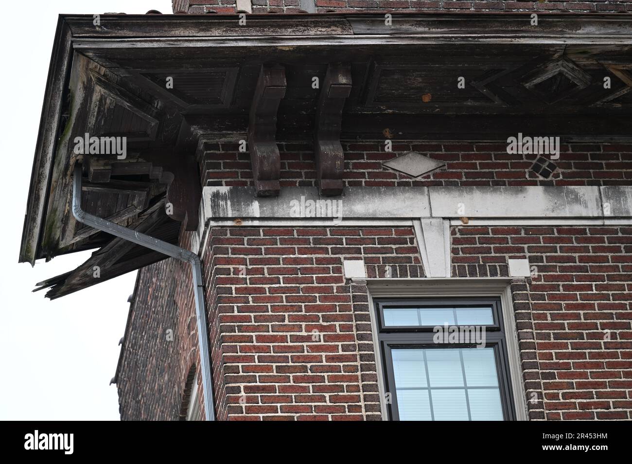 An exterior shot of a modern brick building with a large window ...