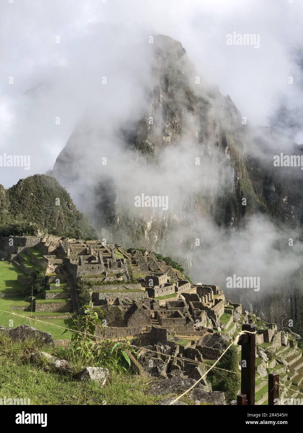 A scenic view of Machu Picchu hidden in clouds. Peru Stock Photo - Alamy