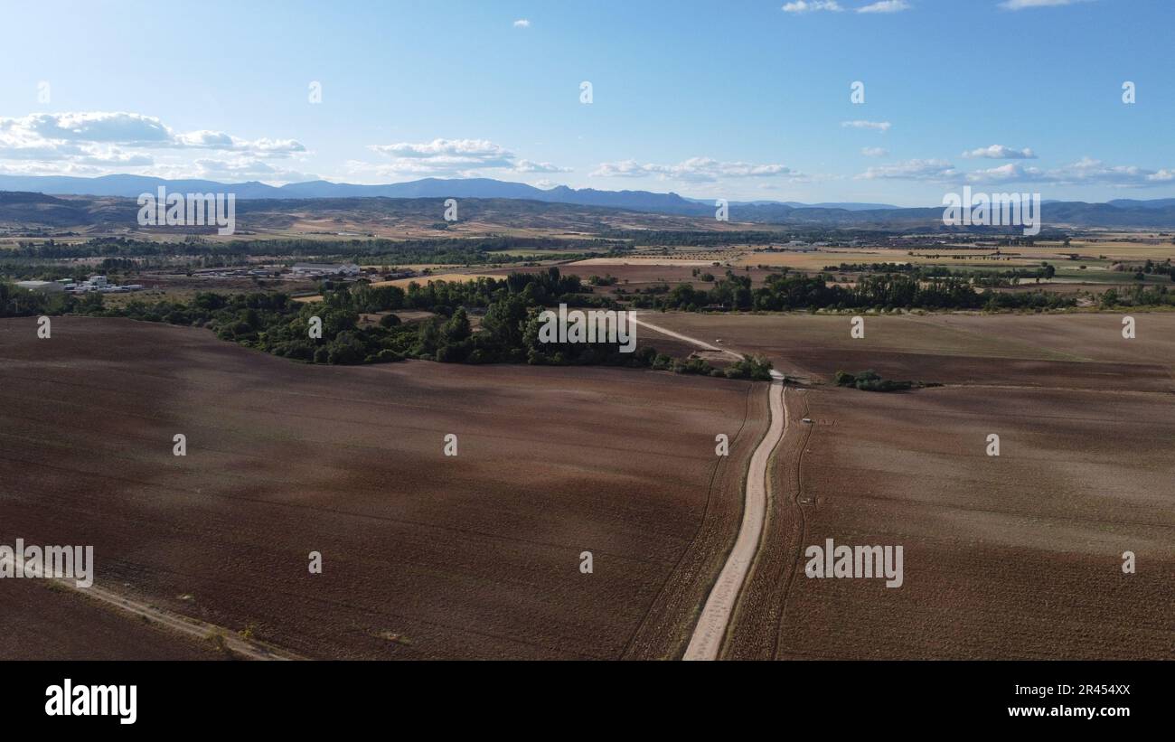 An aerial view of cultivated agricultural fields in the countryside ...