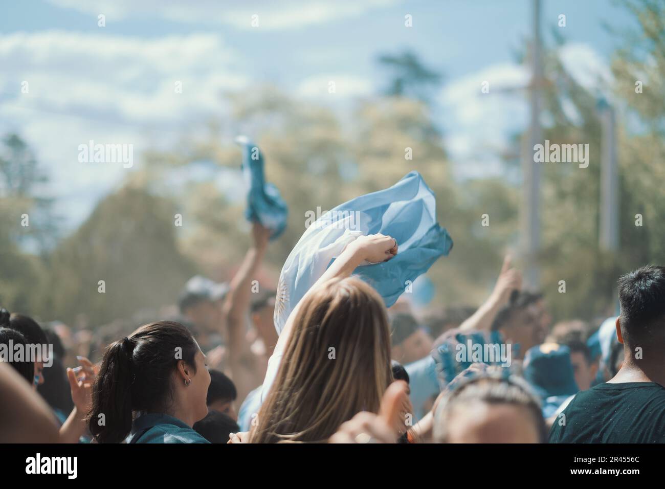 This image captures a crowd of people in Argentina celebrating their ...