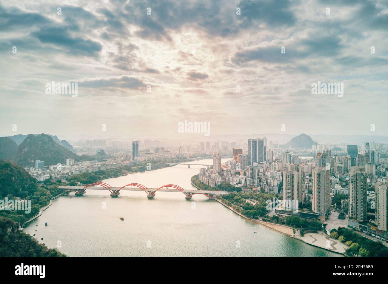The skyline of Liuzhou with Wenhui Bridge over the Liujiang River ...
