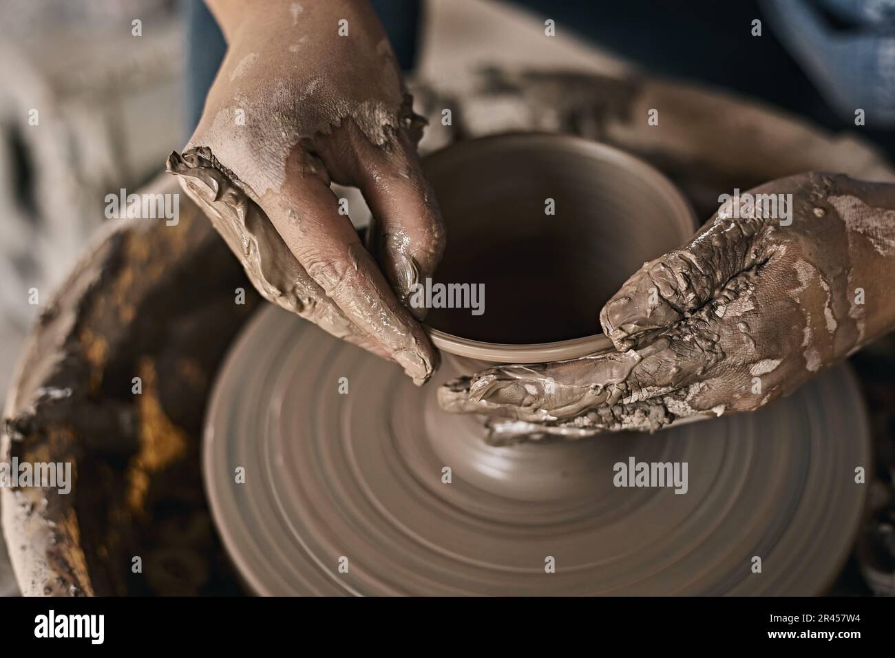 Hands of craftsman artist working on pottery wheel.Selective Focus ...