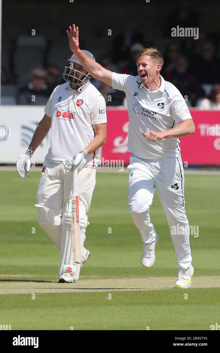 Craig Young of Ireland celebrates taking the wicket of Josh Rymell ...