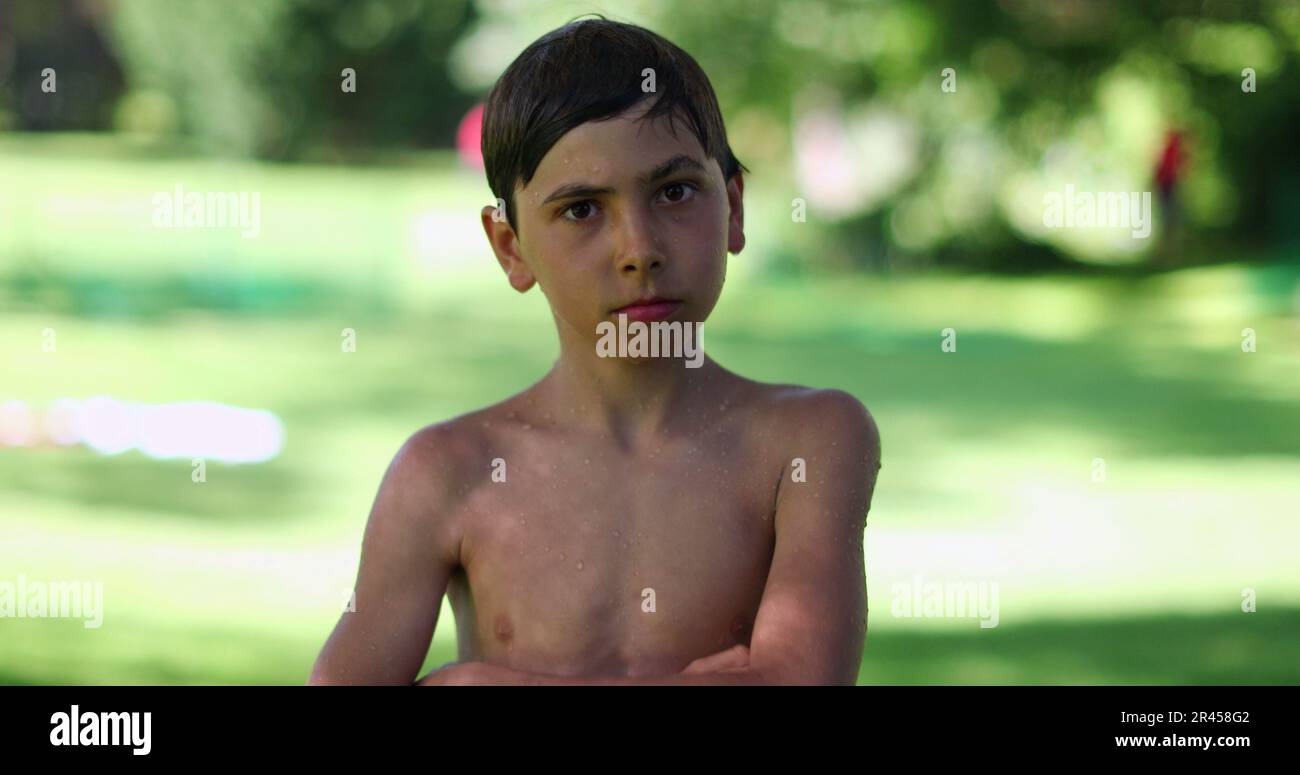 Child negative emotion rejecting offer. Young boy shaking head and ...