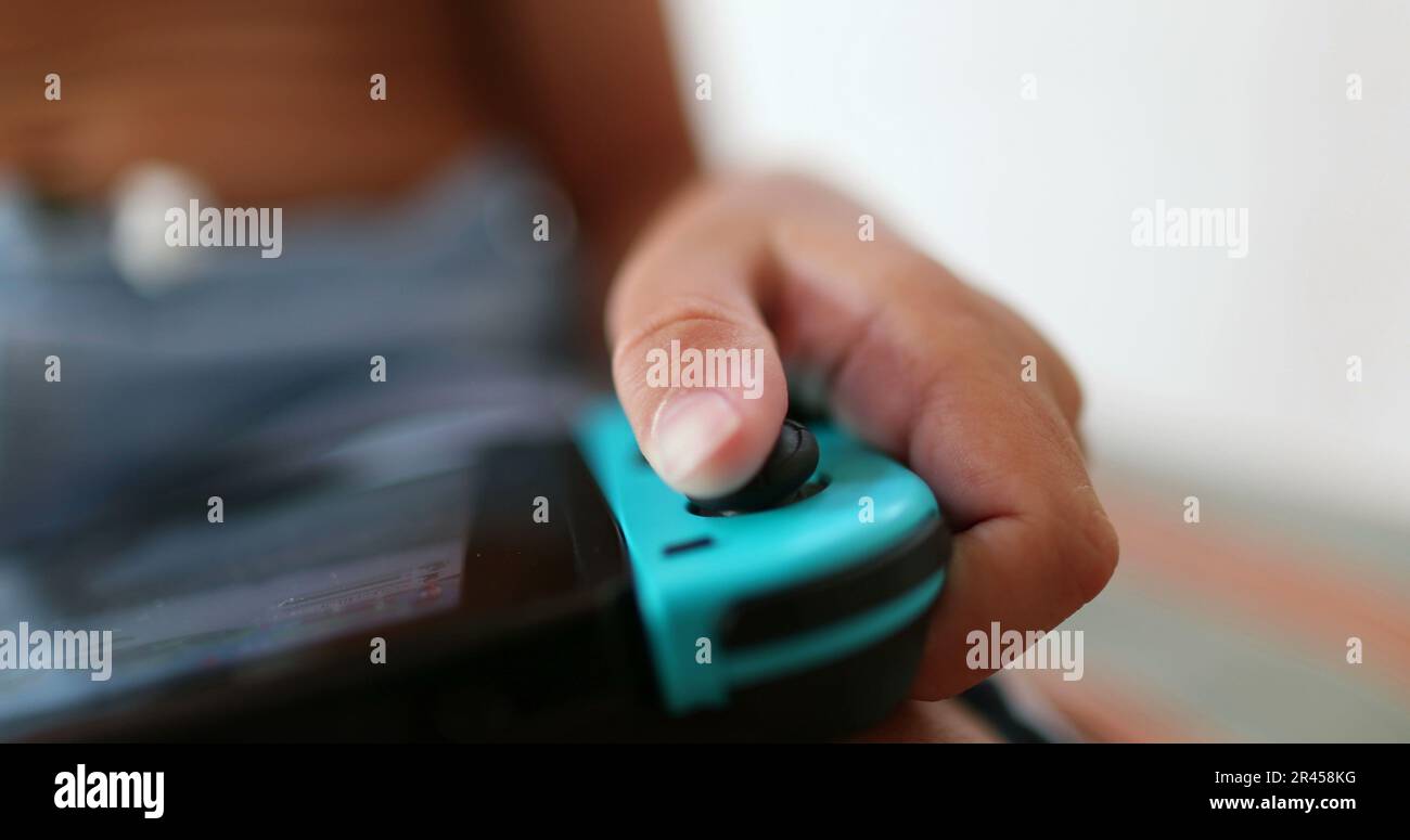 Child hands close-up playing game online. Kid hand and finger on ...
