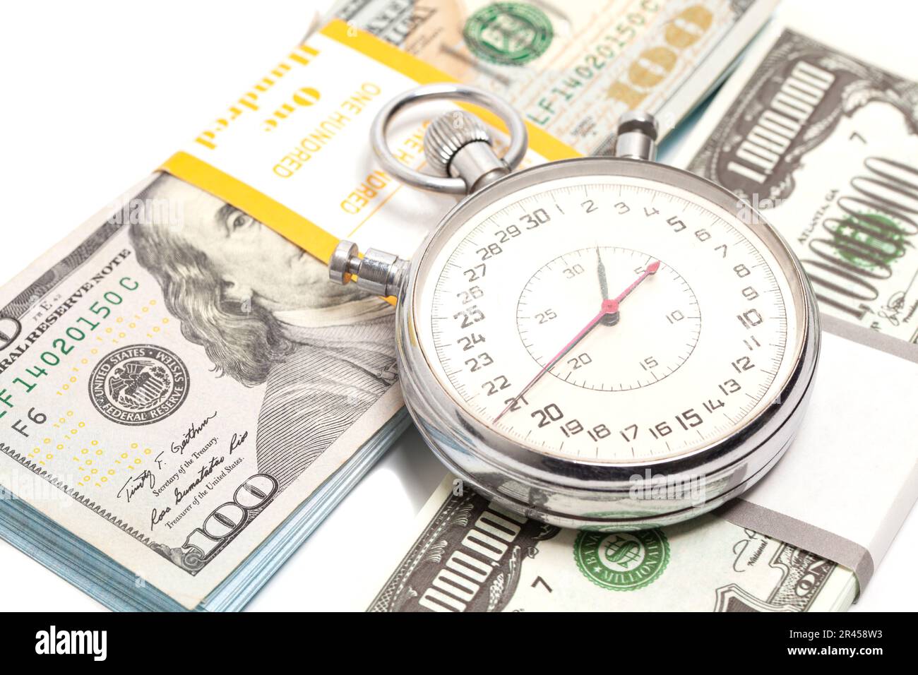Stopwatch with dollar banknotes. Time is money concept Stock Photo - Alamy
