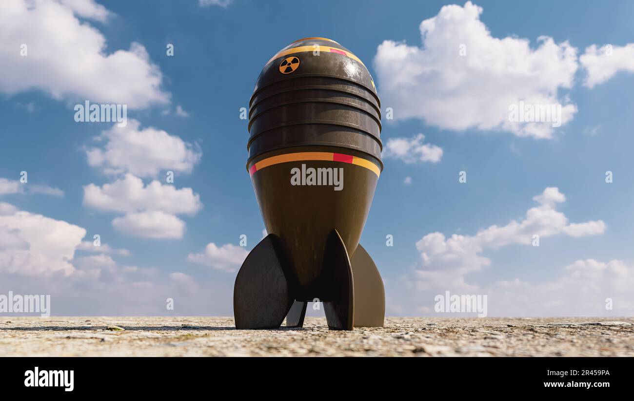 A nuclear bomb, atomic missile on the ground against a blue cloudy sky ...