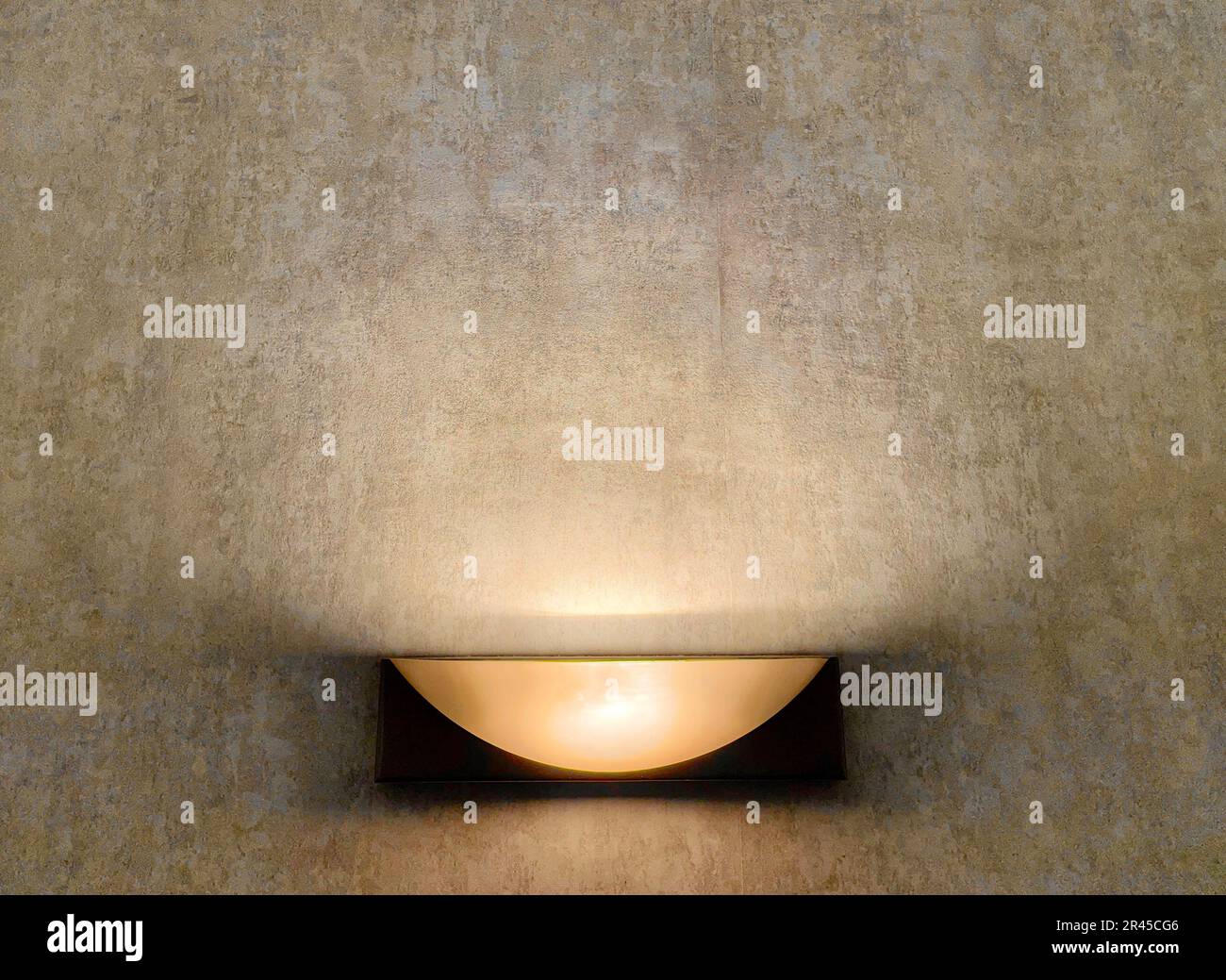 warm light bulb on the wall facing up Stock Photo - Alamy