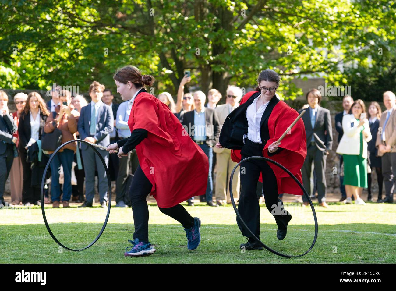 Pupils take part in the annual King's Ely Hoop Trundle on the east lawn ...