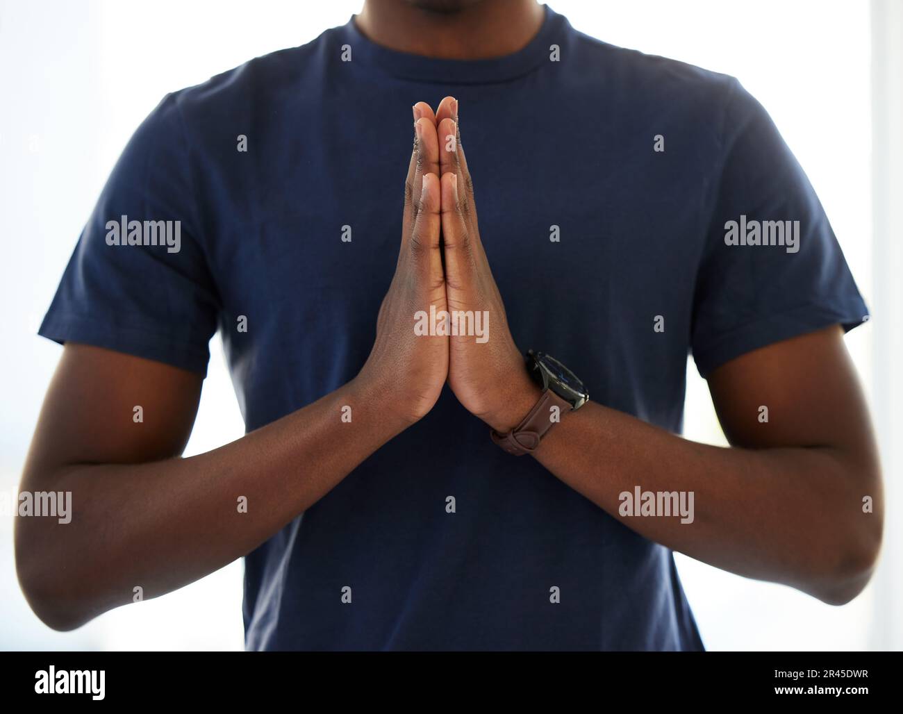 Hands, worship and man praying in studio in hope of help, guidance and ...
