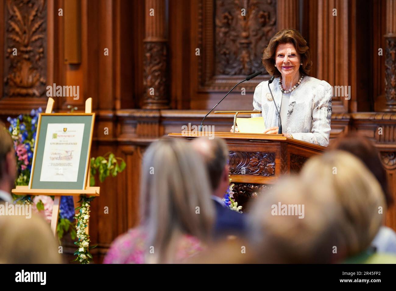 Sweden's Queen Silvia makes a speech as she receives the certificate of ...