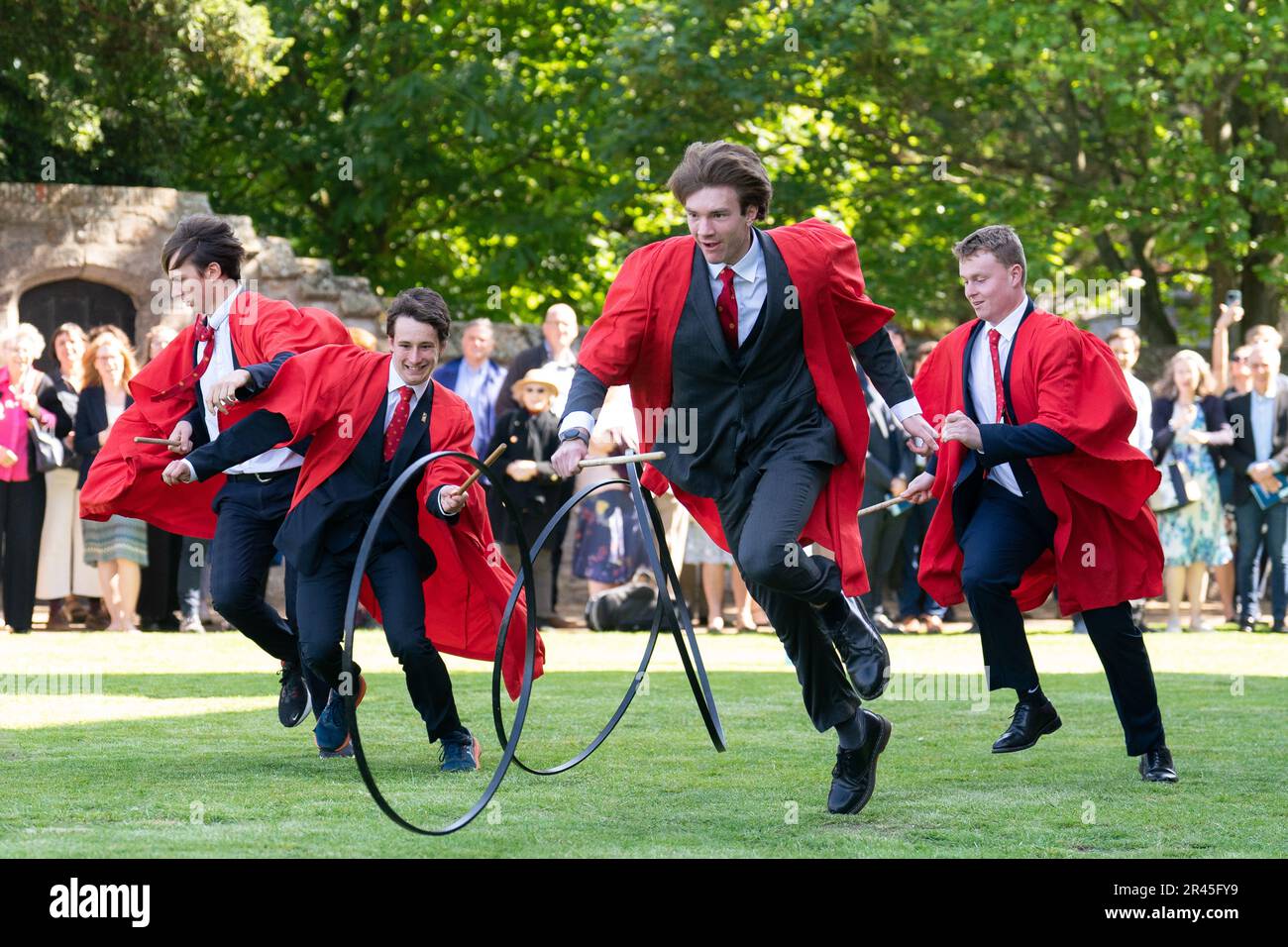 Pupils take part in the annual King's Ely Hoop Trundle on the east lawn ...