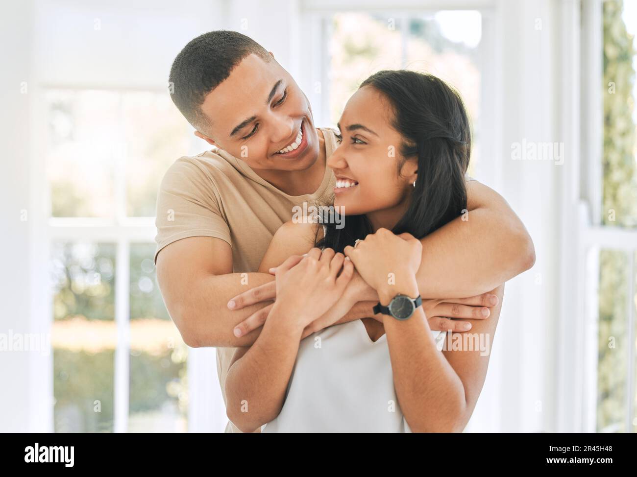 Couple, love and hug in home for happiness, intimacy and relax for ...