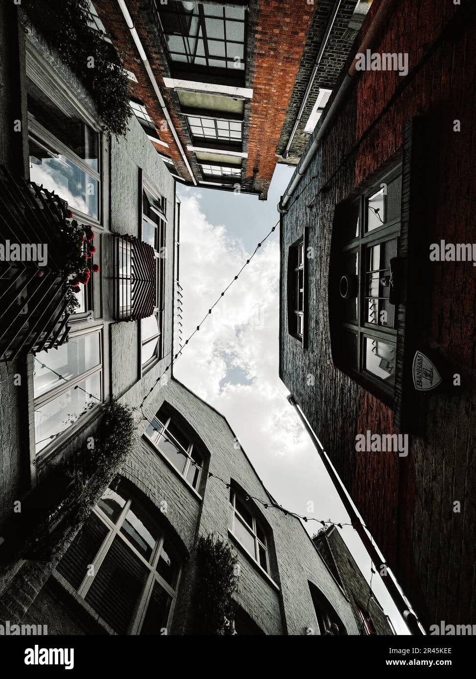 A low angle vertical view of different buildings in London, United ...