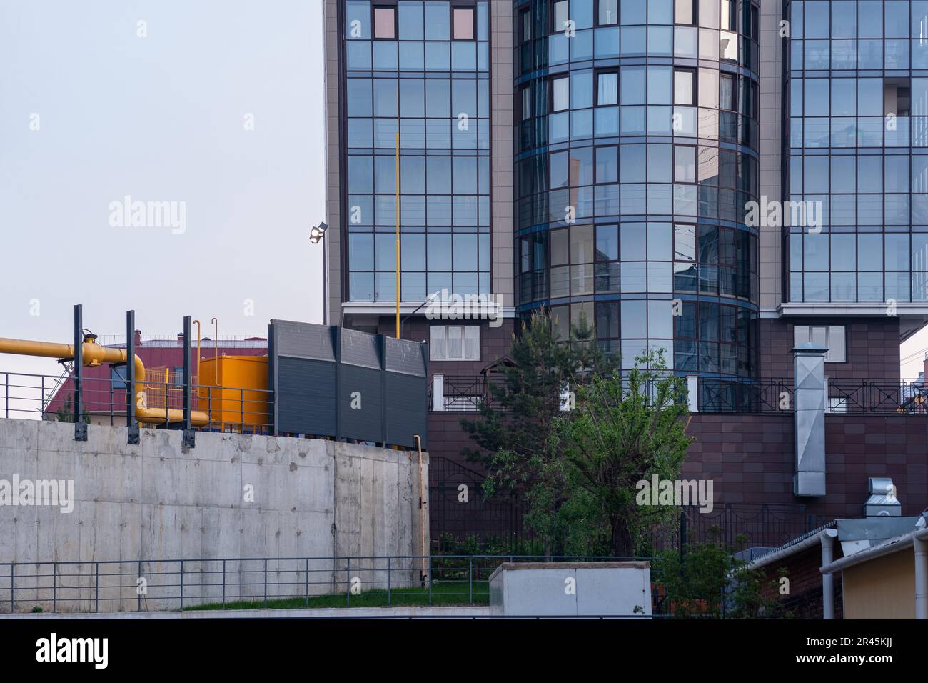 urban background, cityscape with a glass facade of a tall building ...